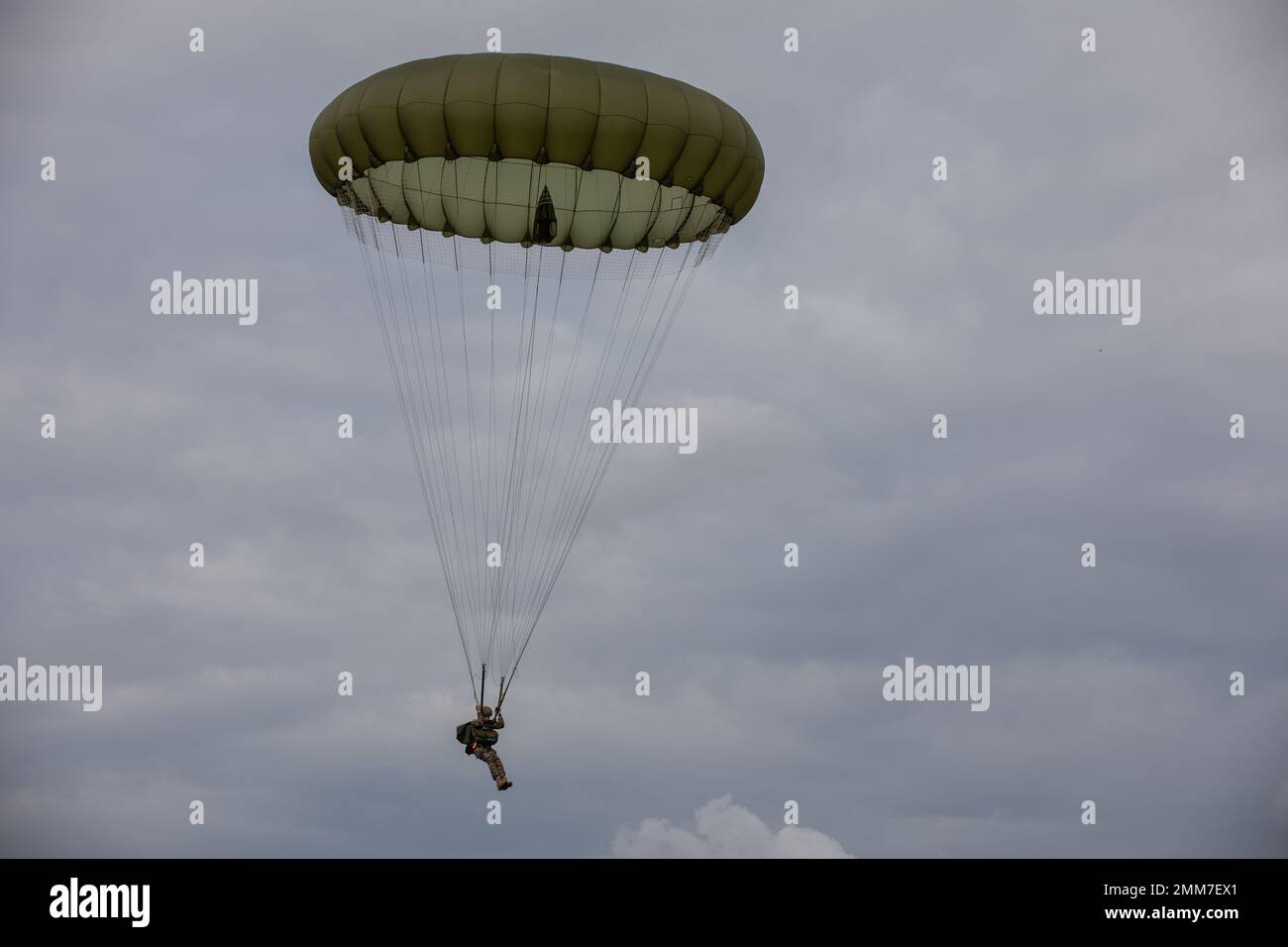 A French Paratrooper conducts an Airborne jump out of a C-130 aircraft ...