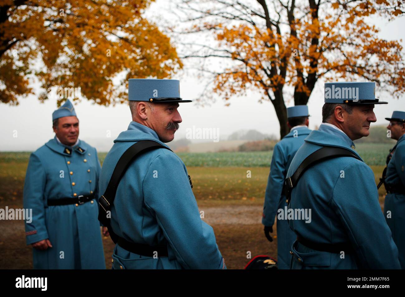 Reenactor soldiers wait for the arrival of French President Emmanuel ...