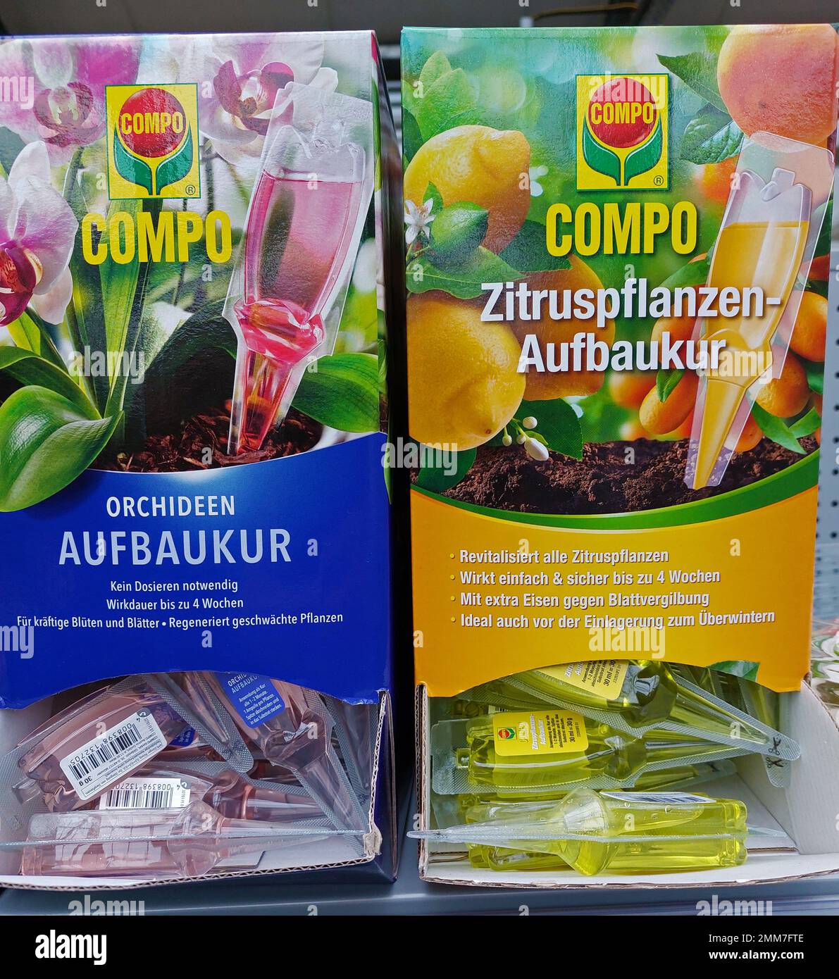 Compo fertilizer packages for orchids and lemon plants Stock Photo - Alamy