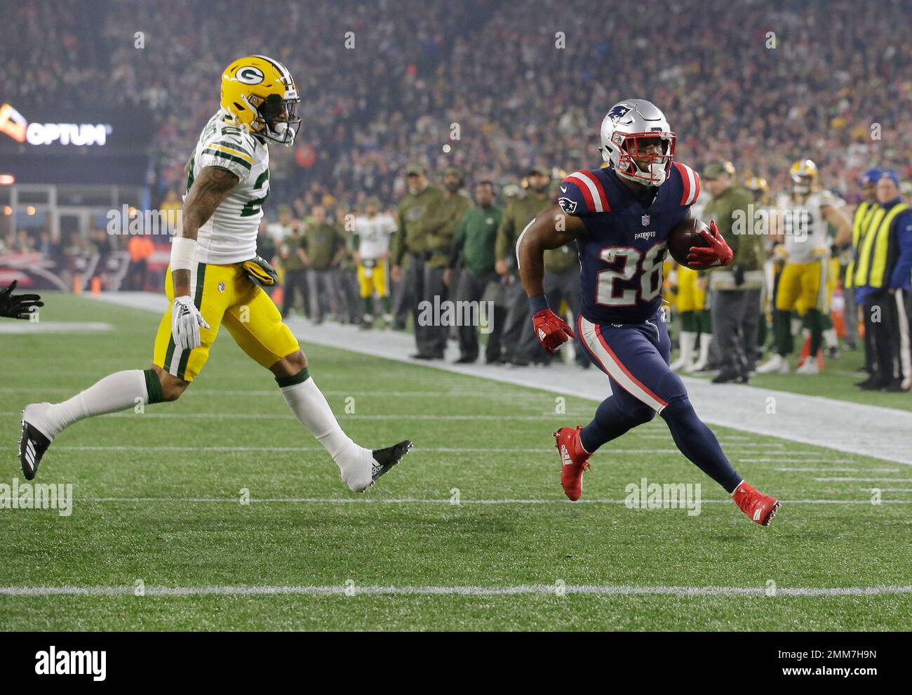 New England Patriots running back James White, right, runs past Green ...