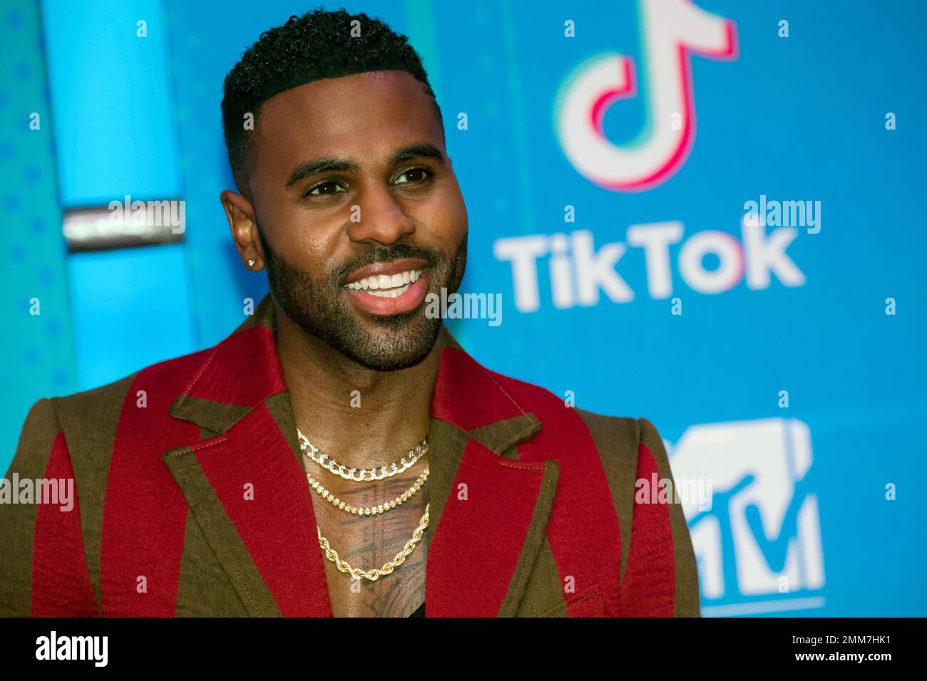 Musician Jason Derulo poses for photographers upon arrival at the ...