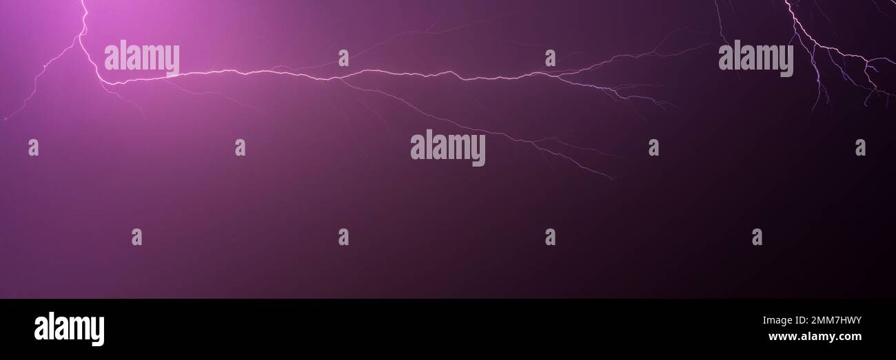 vertical lightning Flashes Across a Stormy Night Sky Stock Photo - Alamy