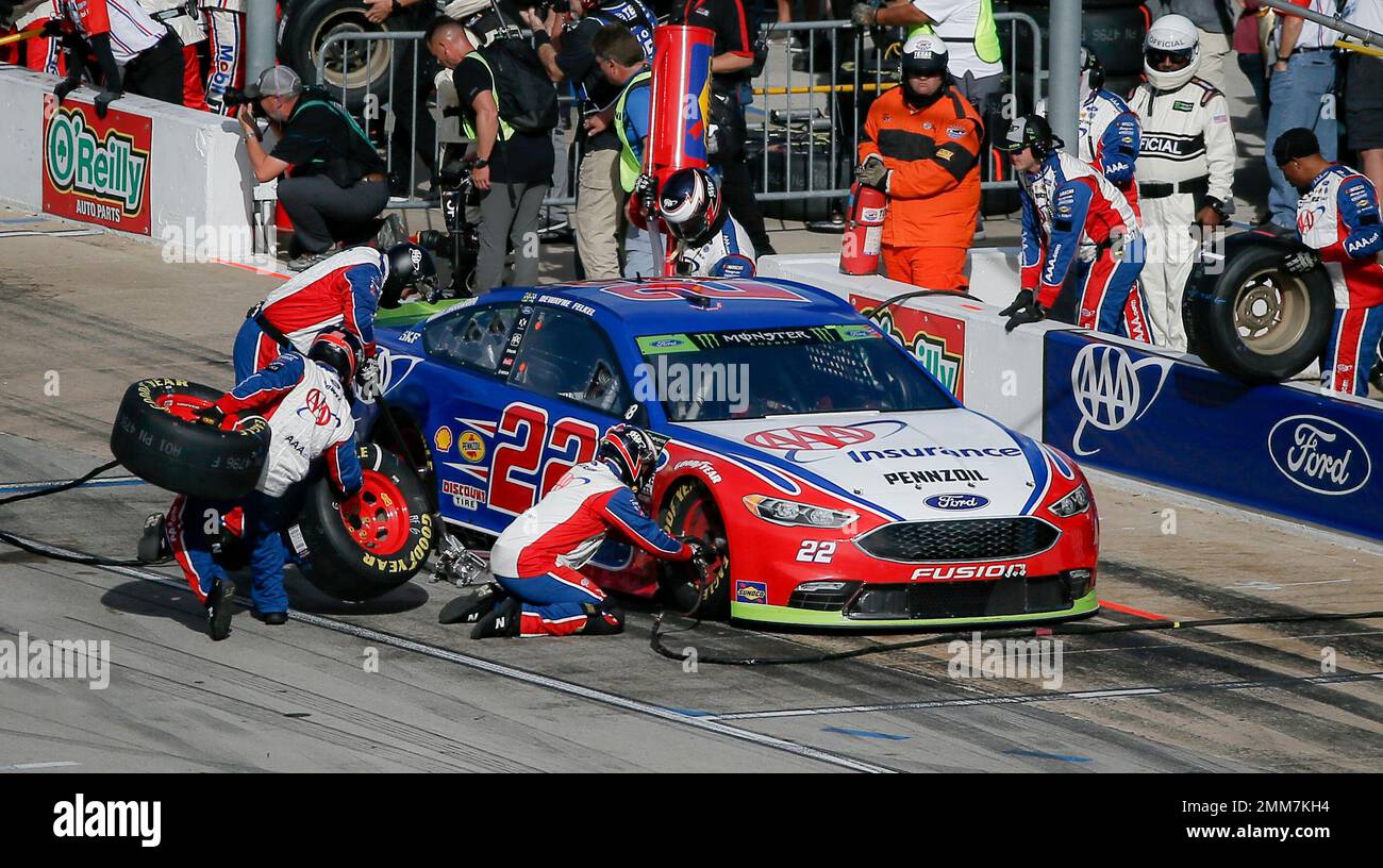Joey Logano's pit crew services his car during a NASCAR Cup auto race ...