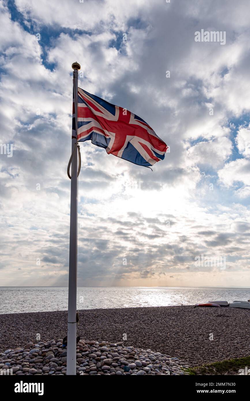 Union flag flying over beach in Devon, UK Stock Photo - Alamy