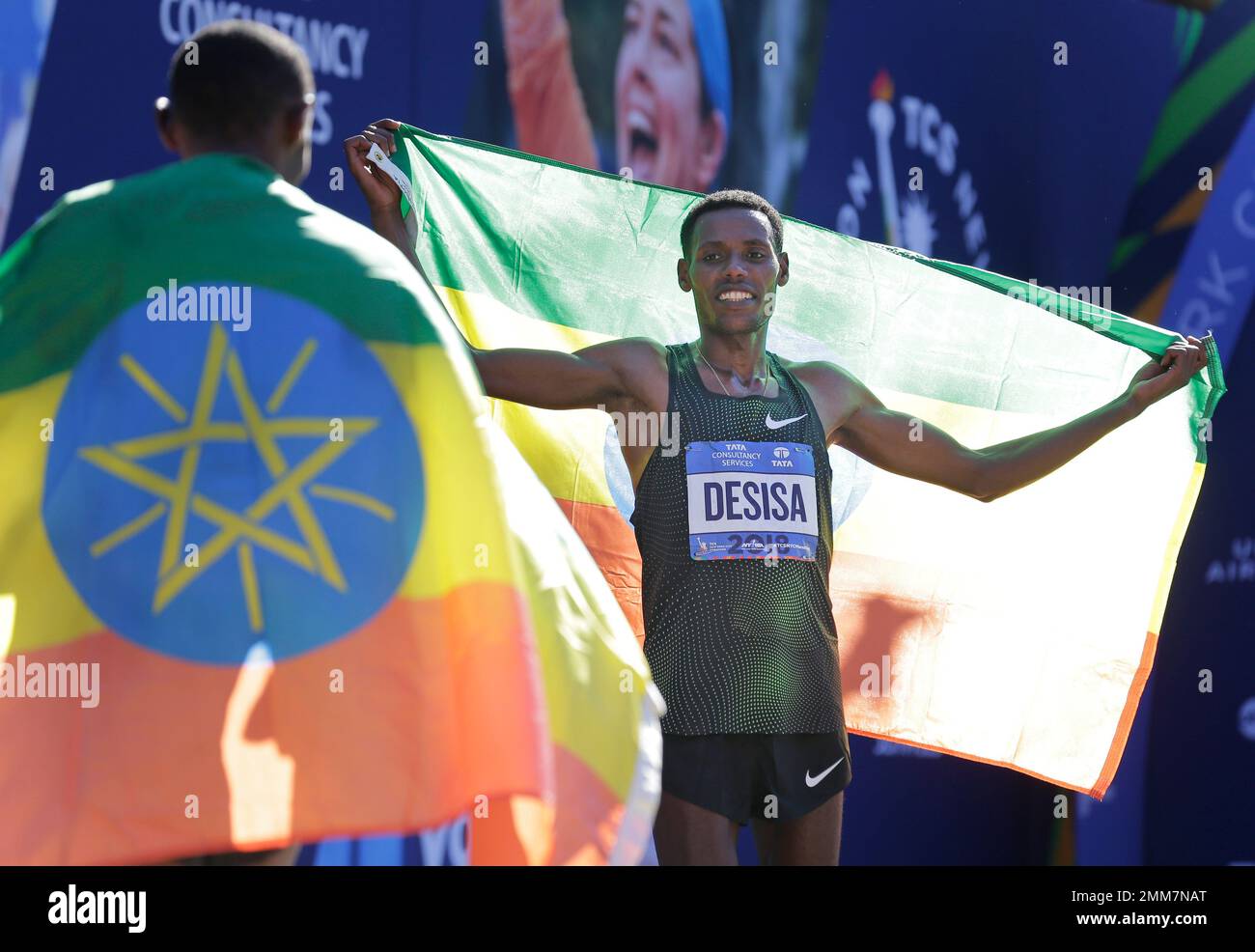 First place finisher Lelisa Desisa of Ethiopia poses for a picture at ...