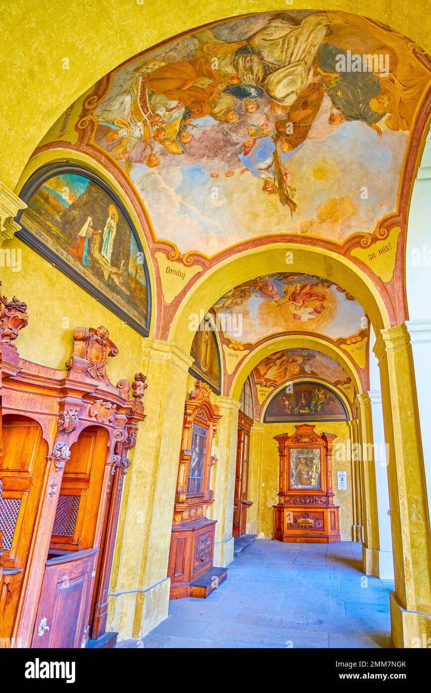 Explore covered corridors of cloister with medieval frescoes, Loreta of ...