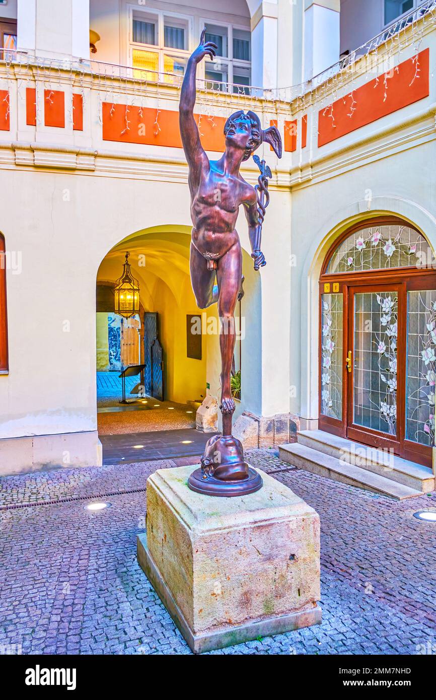 The bronze sculpture to Mercury, the Roman God in a tiny courtyard in ...