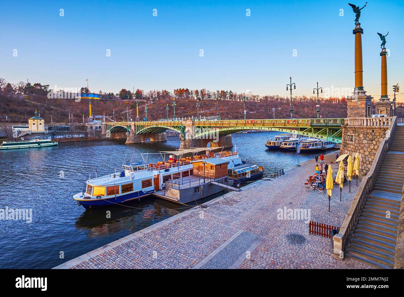 The walking promenade on Dvorak embankment and the Cech Bridge on ...