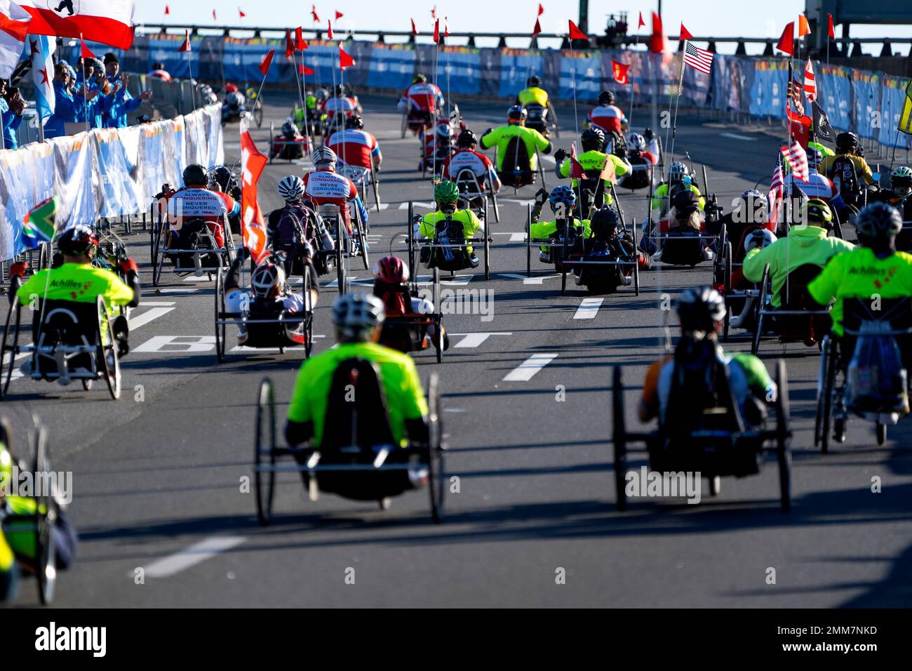 Competitors in the handcycle division leave the starting line during ...