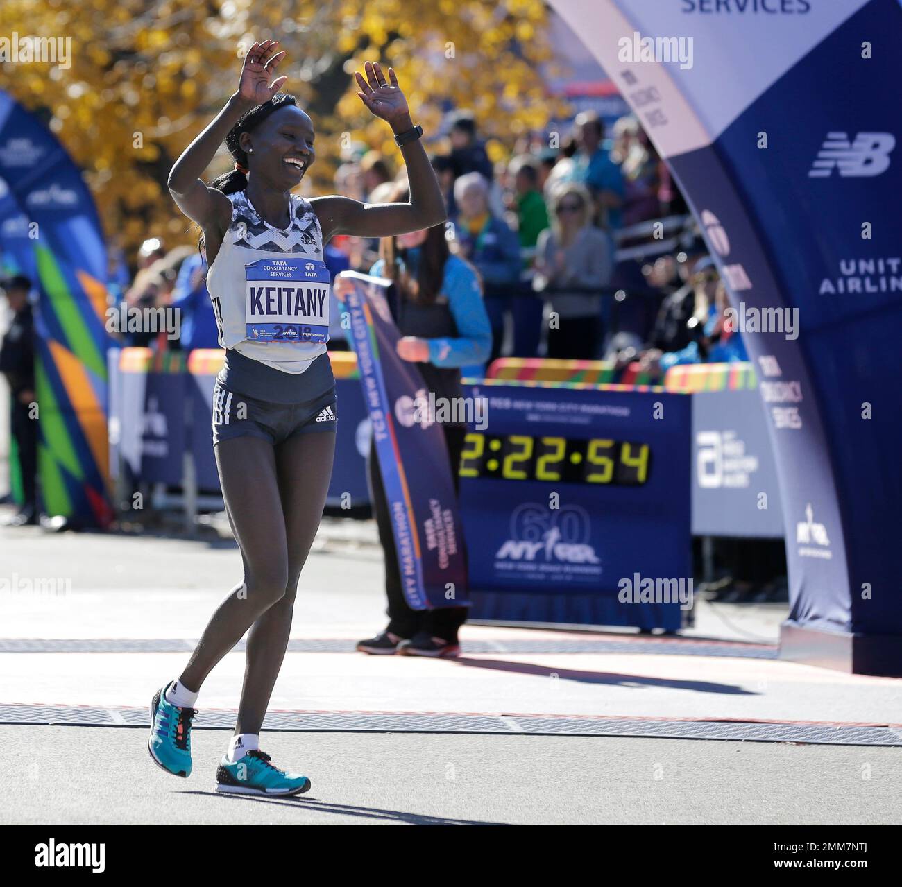 Mary Keitany of Kenya celebrates after crossing the finish line first ...
