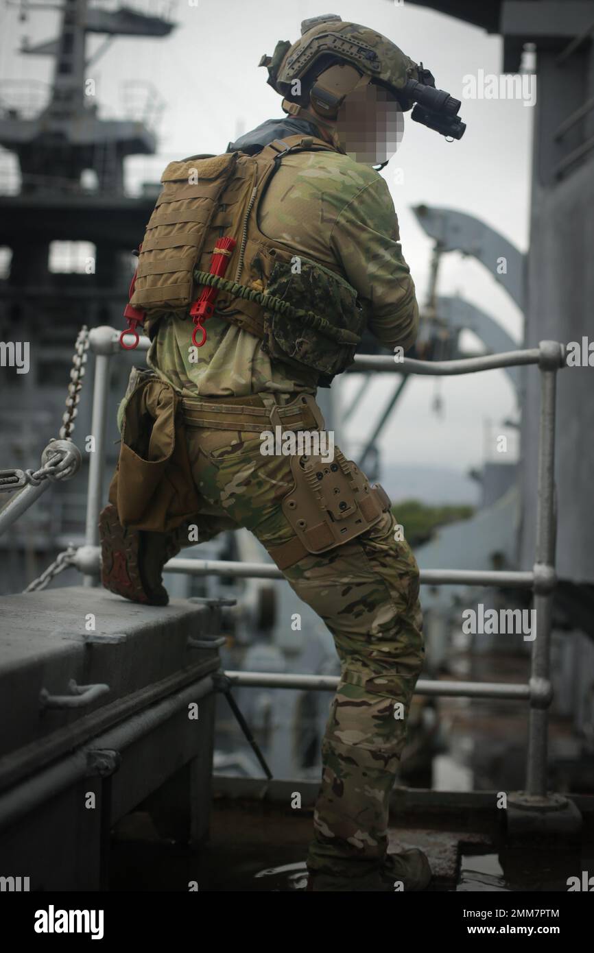 A U.S. Sailor assigned to a Navy SEAL Team, conducts Visit, Board ...