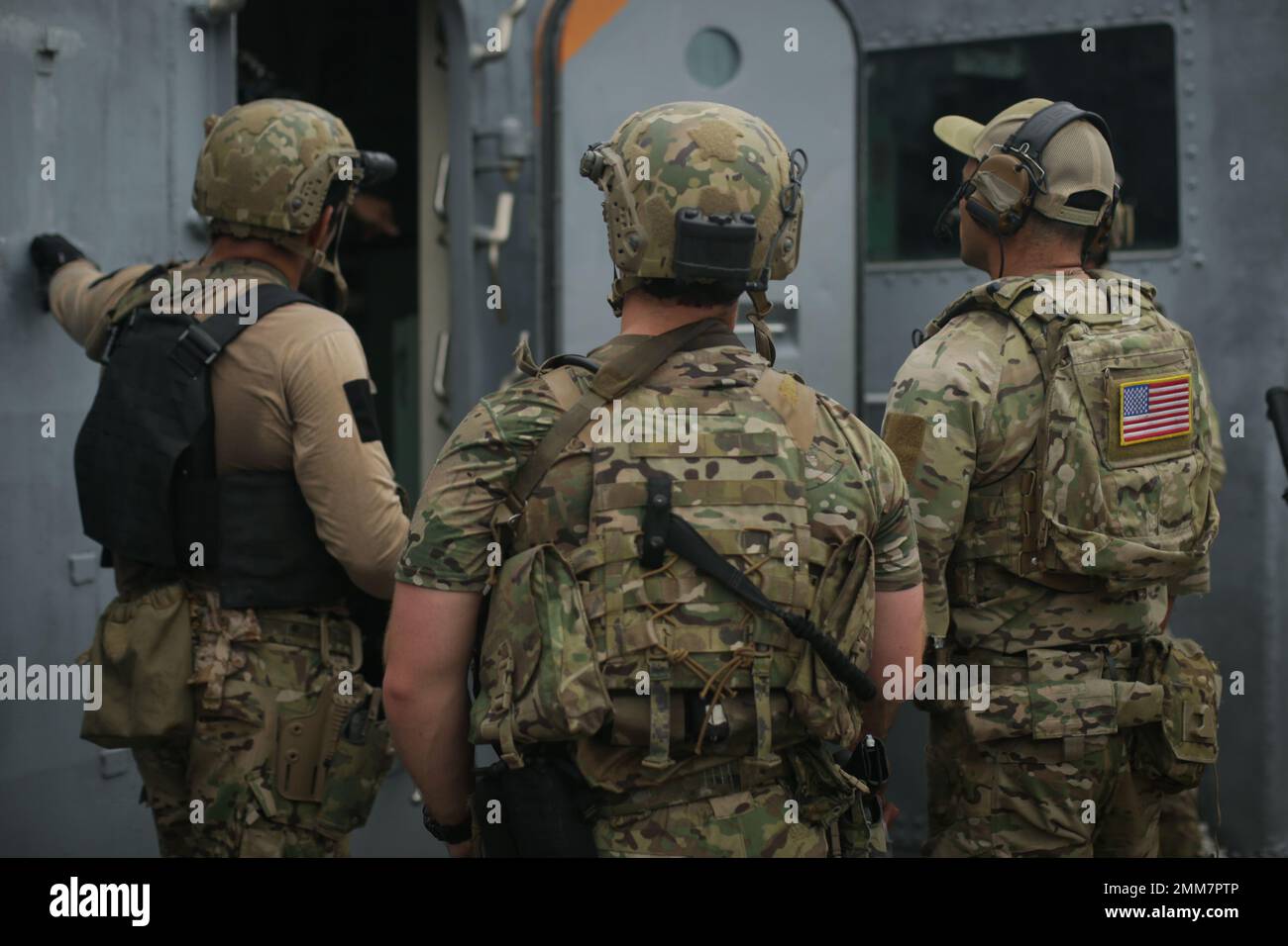 U.S. Sailors assigned to a Navy SEAL Team, evaluate the multinational ...