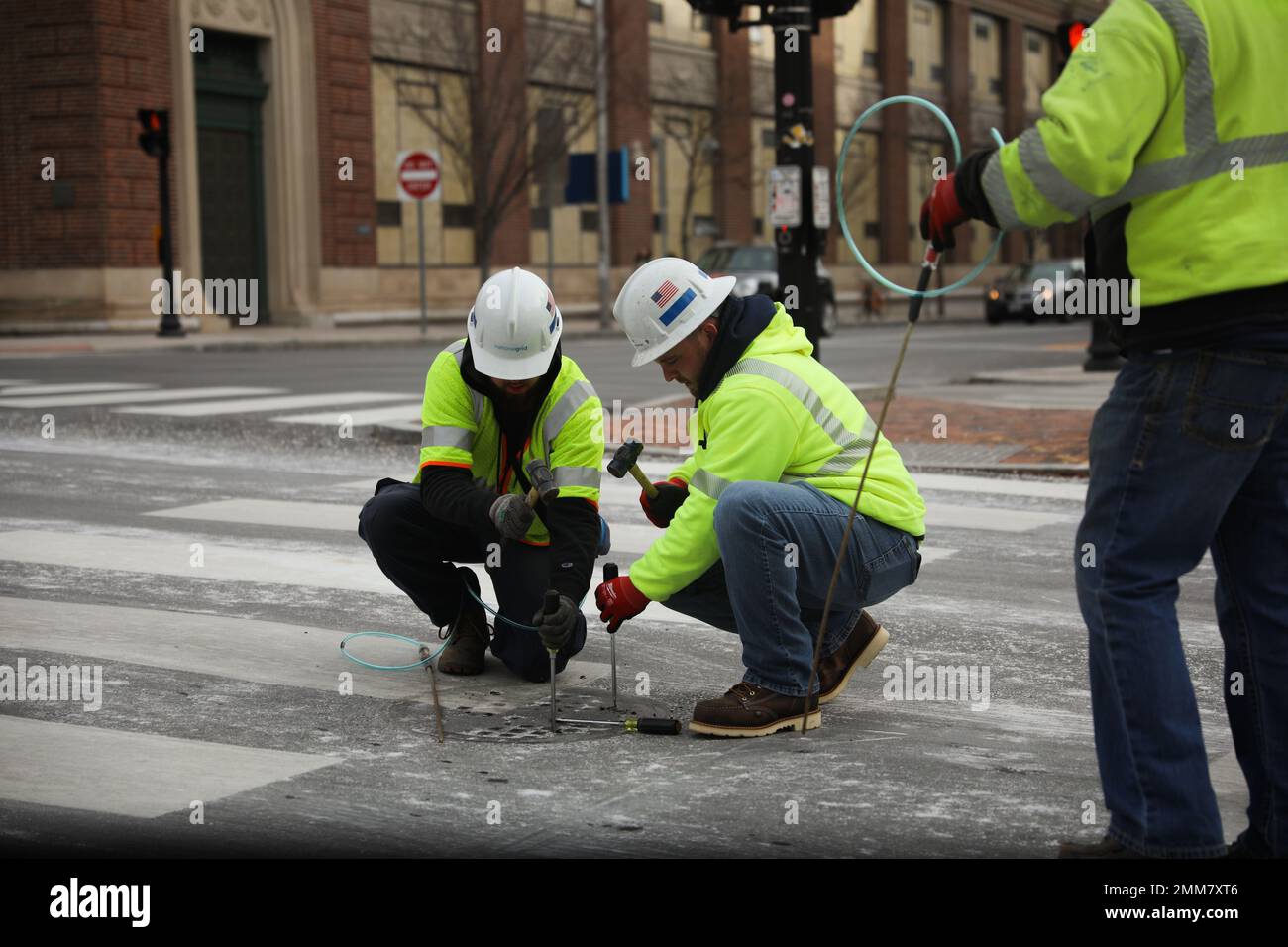 Construction Workers working at construction site yellow jacket helmet ...
