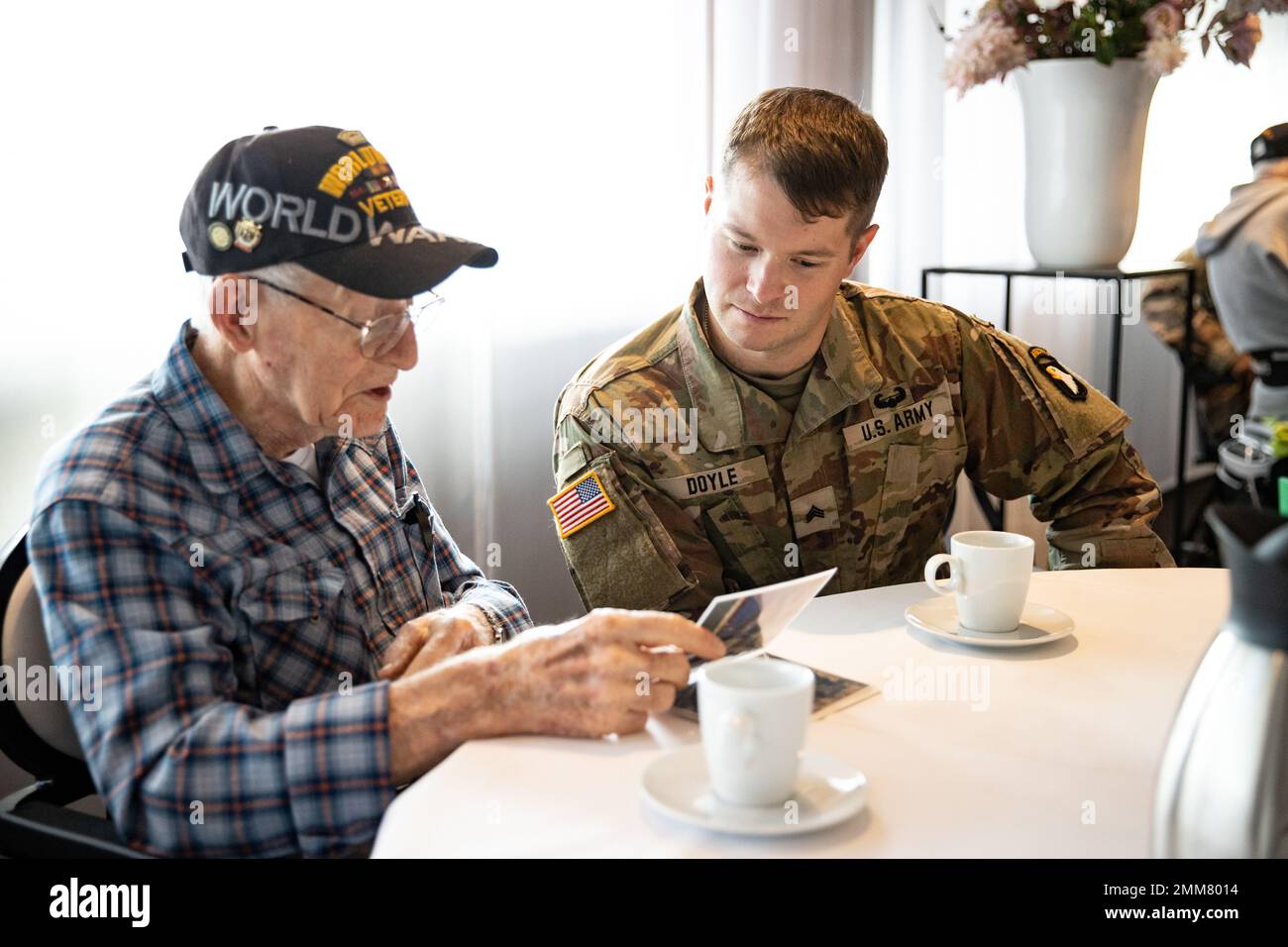 Mr. Jerimiah Tuttle, a U.S. Navy World War II veteran, shows photos of ...