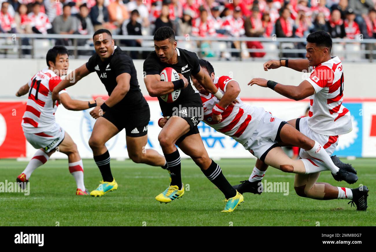 New Zealand's Richie Mo'unga runs through the Japanese defence during ...