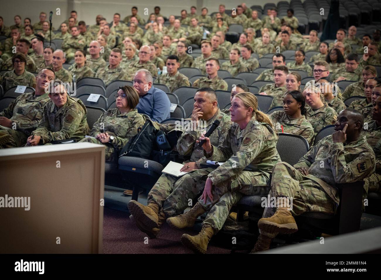 U.S. Air Force Chief Master Sergeant Rachel Landegent, center right ...