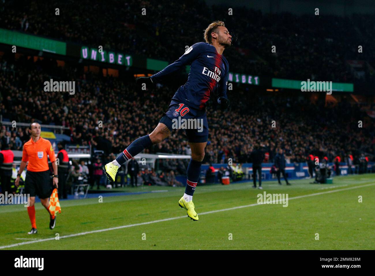 PSG's Neymar, jumps in the air celebrating after he scored his side ...