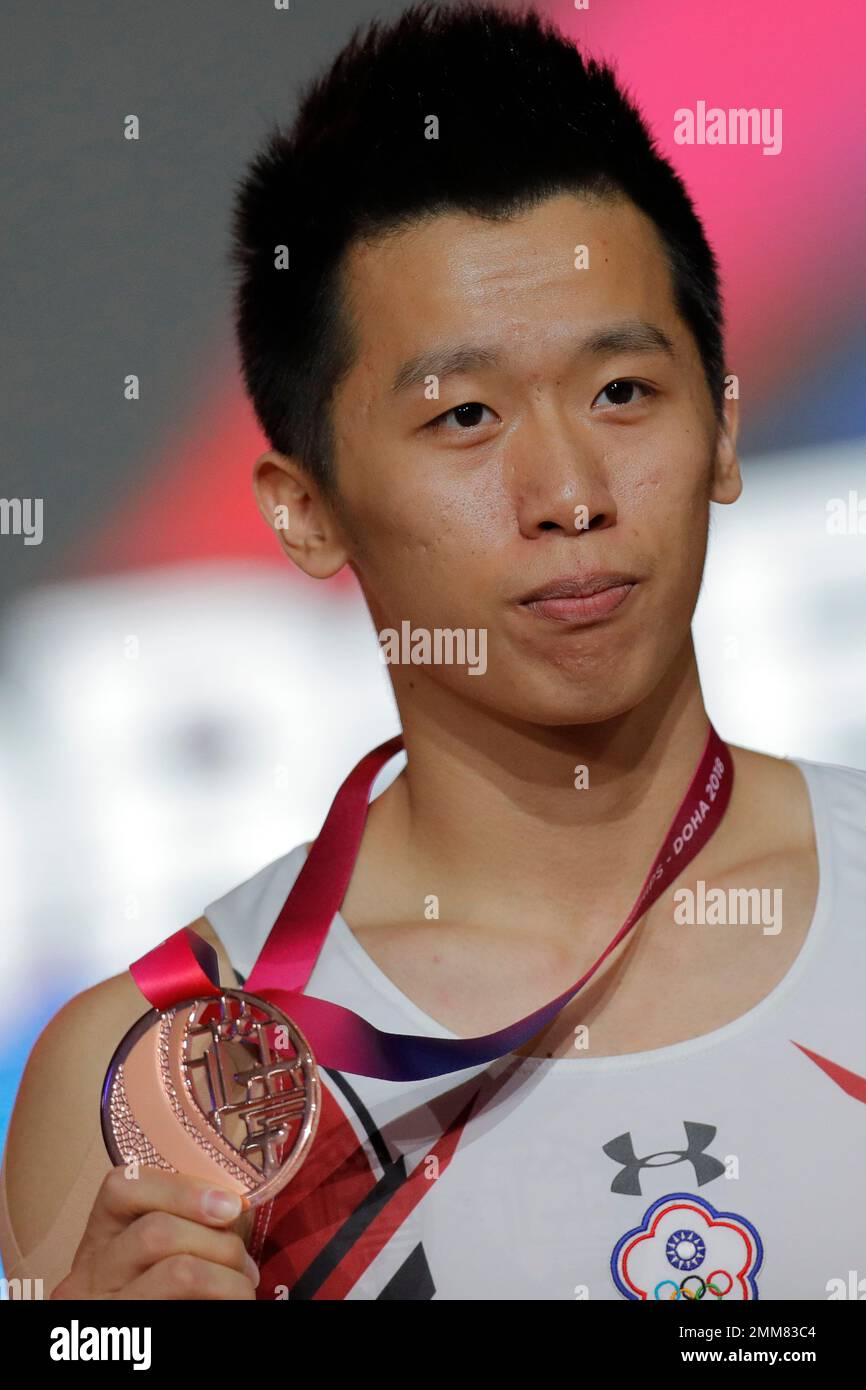 Taiwan's Lee Chih Kai shows his bronze medal after the men's pommel horse final on the first day ...