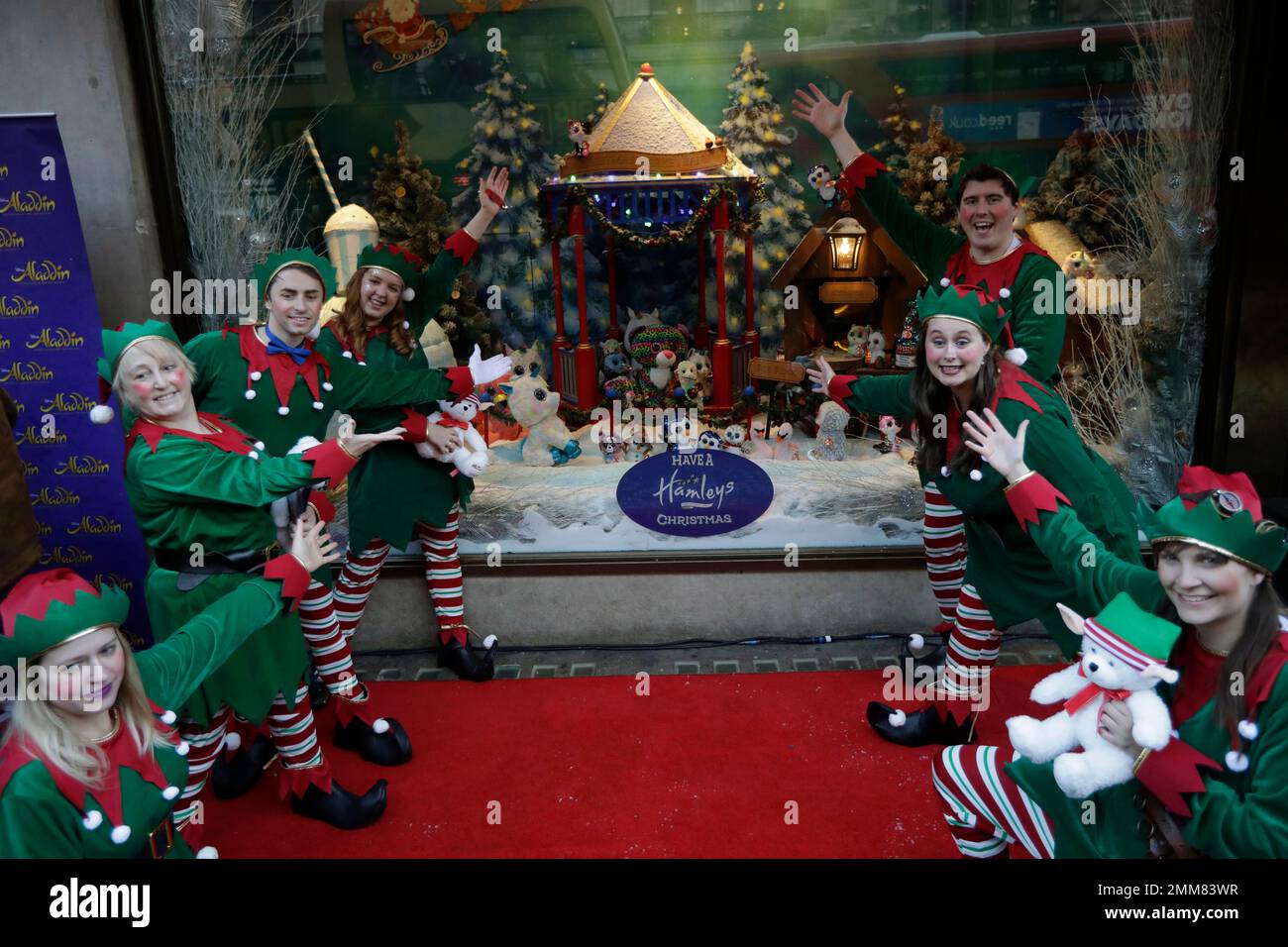 Hamleys elves pose for photographers in front of the newly unveiled ...