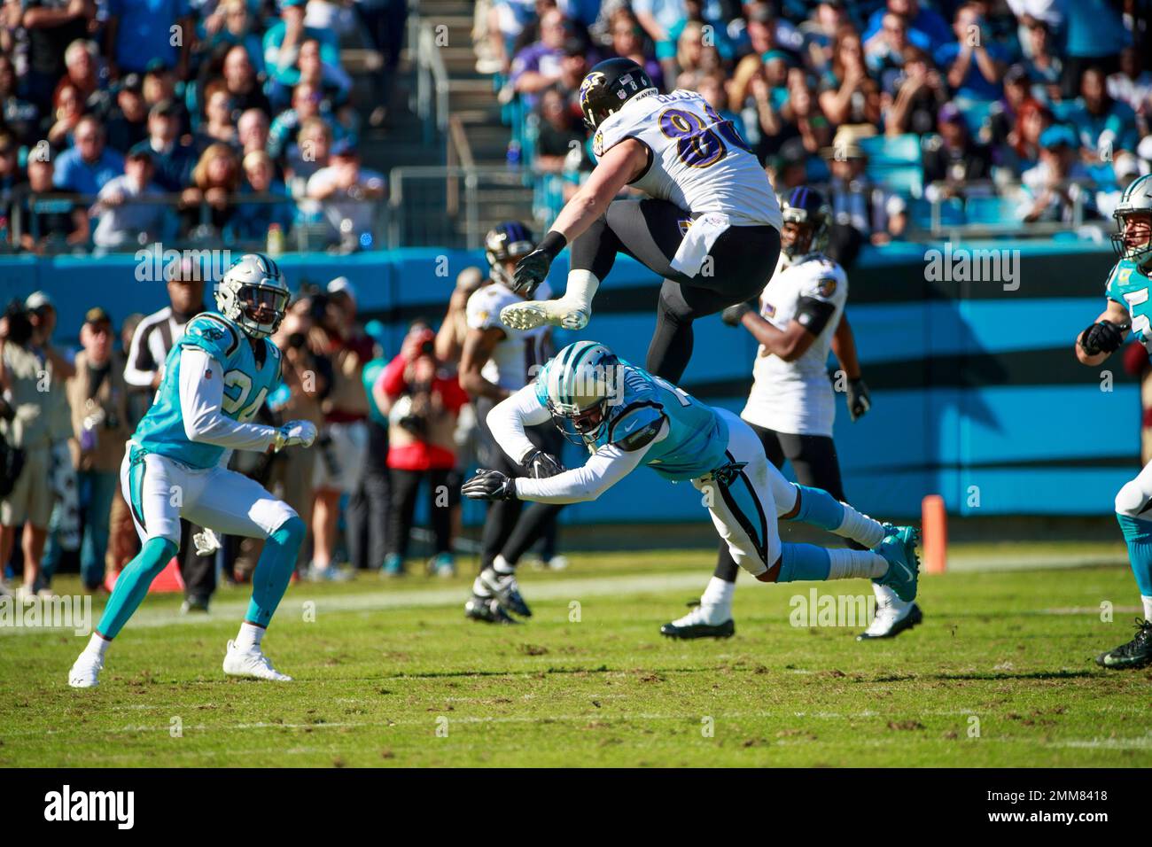 Baltimore Ravens tight end Nick Boyle (86) leaps over Carolina Panthers ...