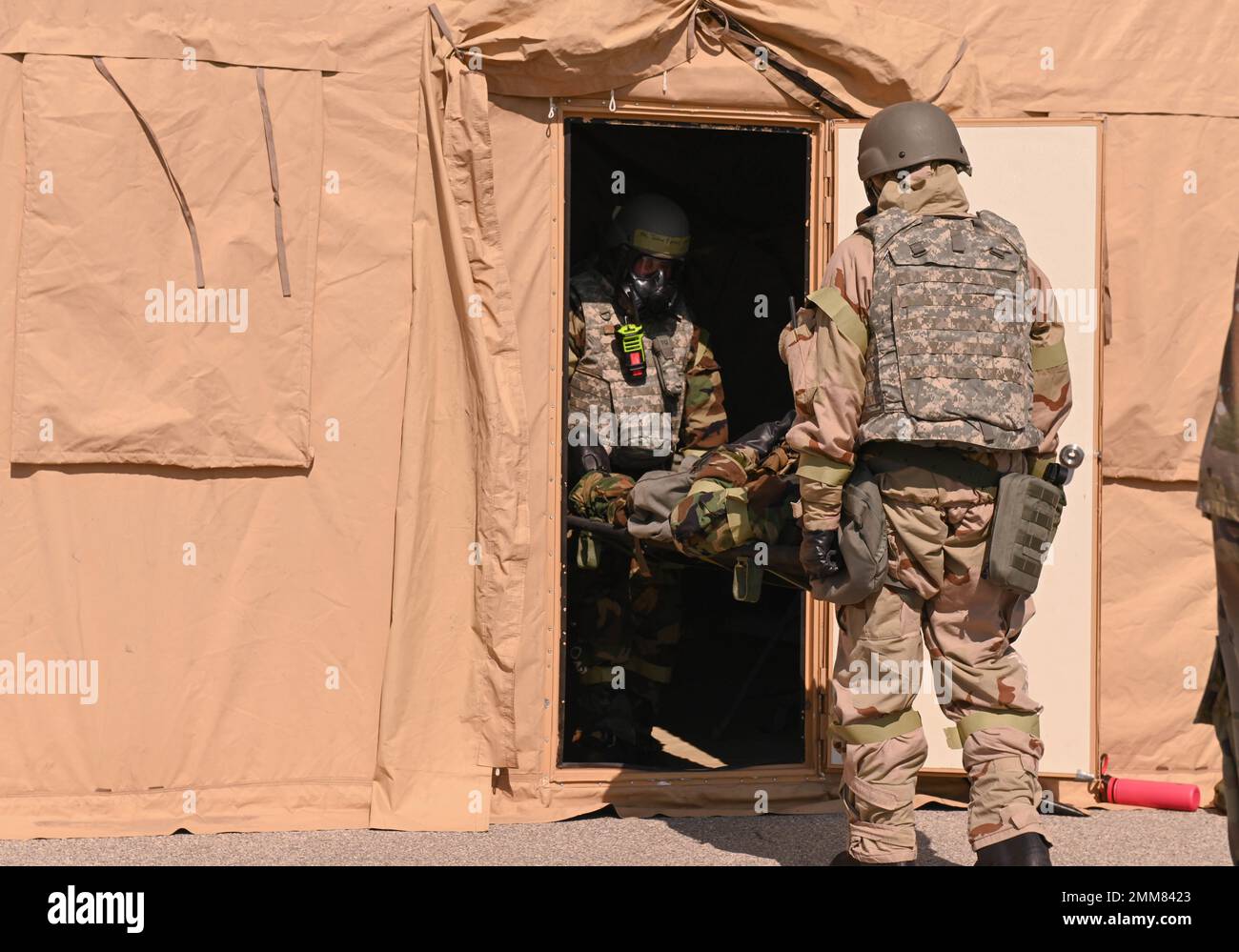 U.S. Air Force Airmen from the 509th Medical Group perform a litter ...