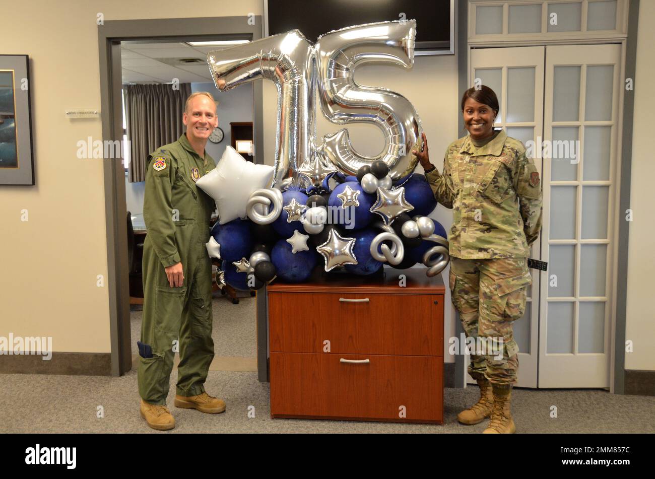 Col. Joseph Janik and Chief Master Sgt. Rosiline Ratliff poses by the ...