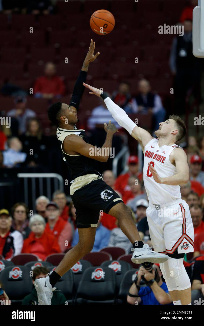 UNC Pembroke forward Akia Pruitt, left, goes up for a shot against Ohio ...