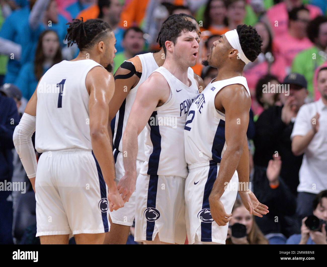 Penn State's Jalen Pickett,right, reacts to a three point shot by ...