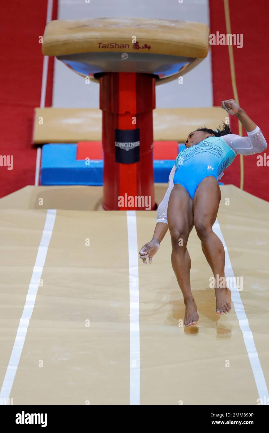 Simone Biles of the U.S. misses her landing after her jump on the vault ...