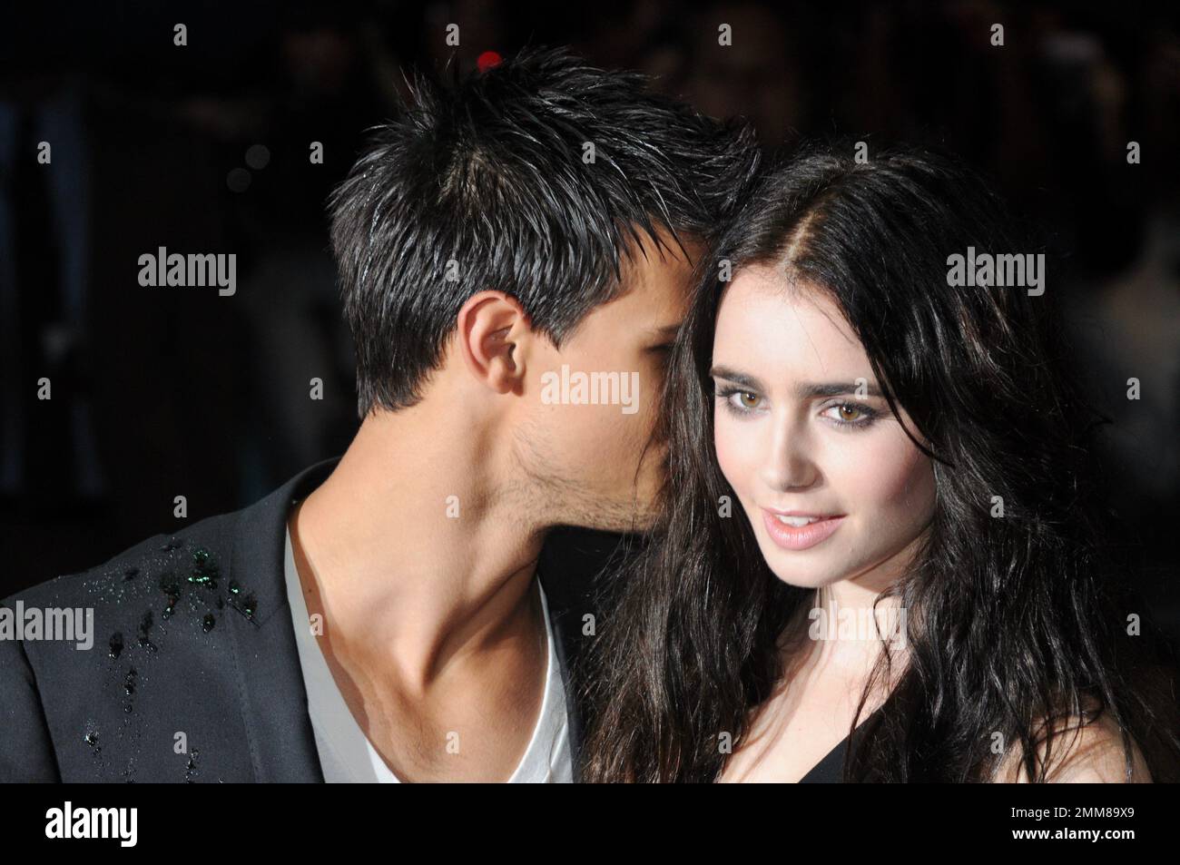 Taylor Lautner, Lily Collins, Taylor Lautner whispers in Lily Collin's ...