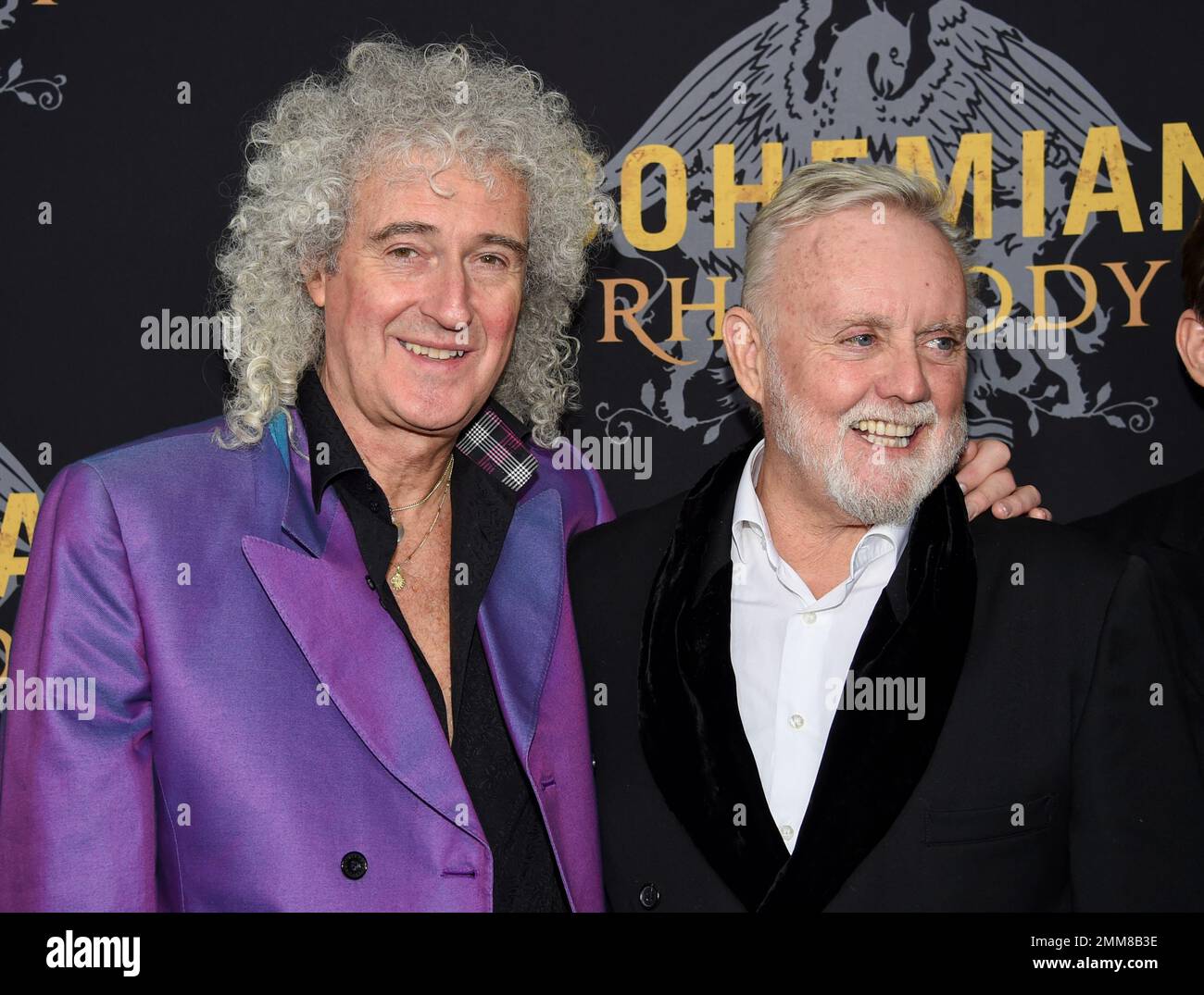 Queen band members Brian May, left, and Roger Taylor attend the ...