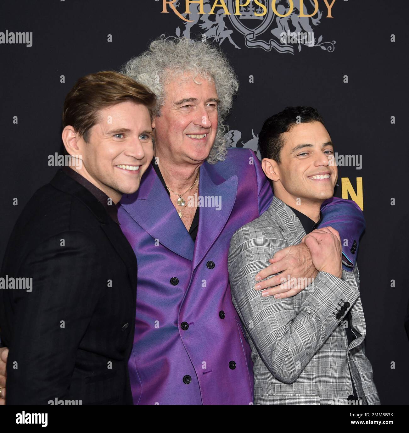 Musician Brian May, center, poses with actors Allen Leech, left, and ...