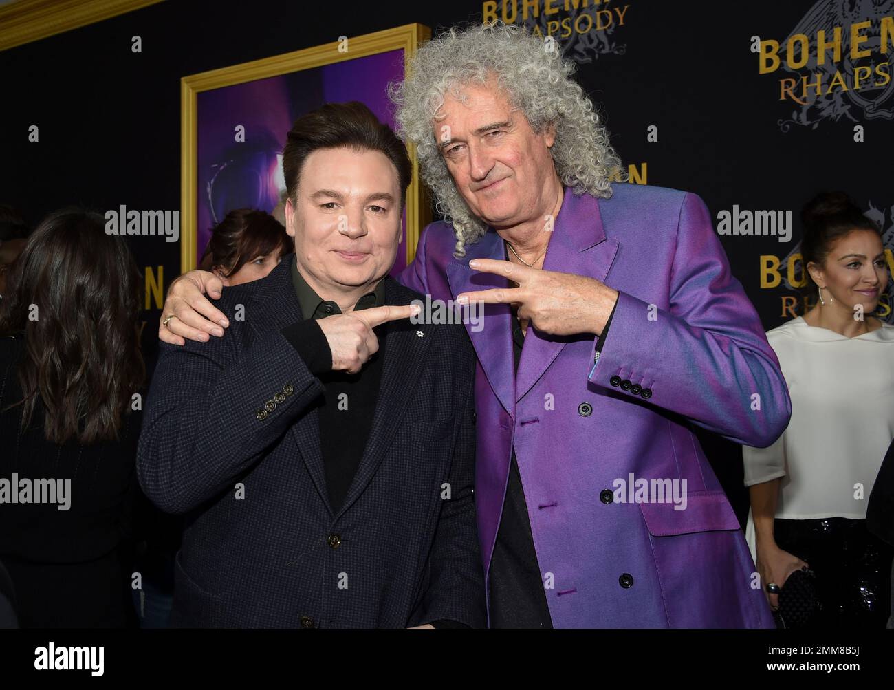 Actor Mike Myers, left, and musician Brian May attend the premiere of ...