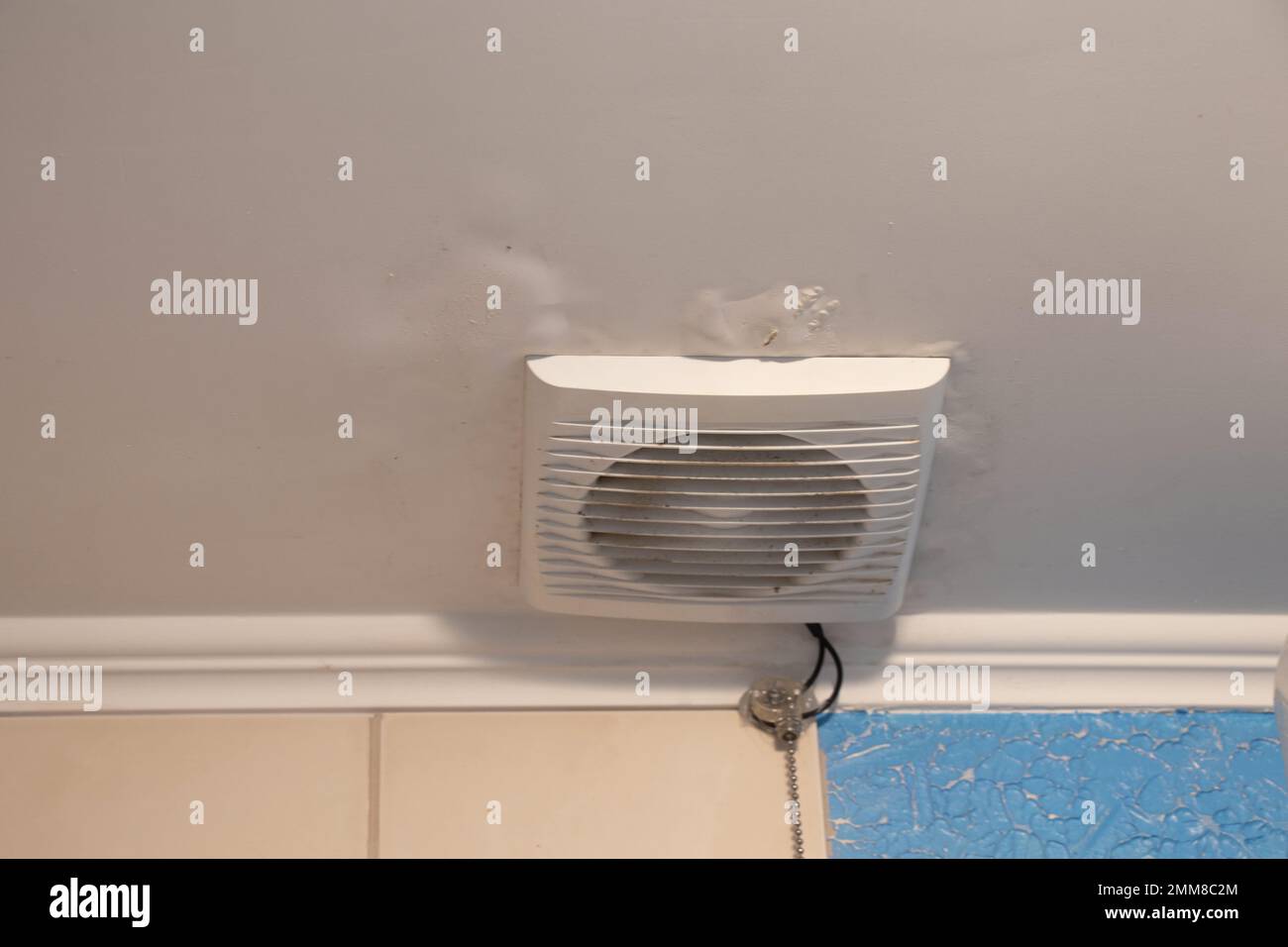 electric hood on the ceiling in the bathroom in the apartment ...
