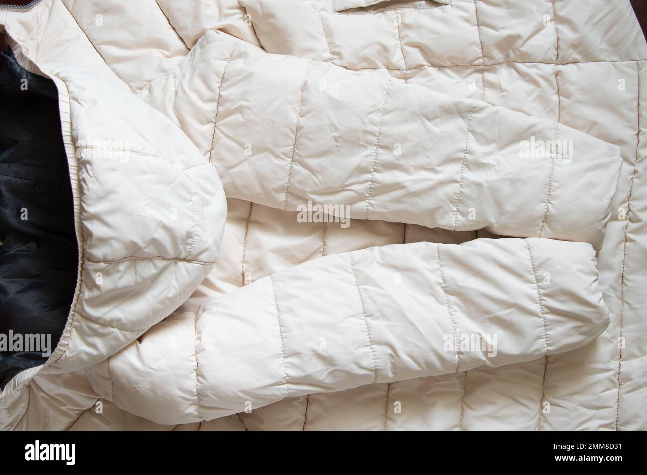 women's padded white soft jacket as background, background of soft ...