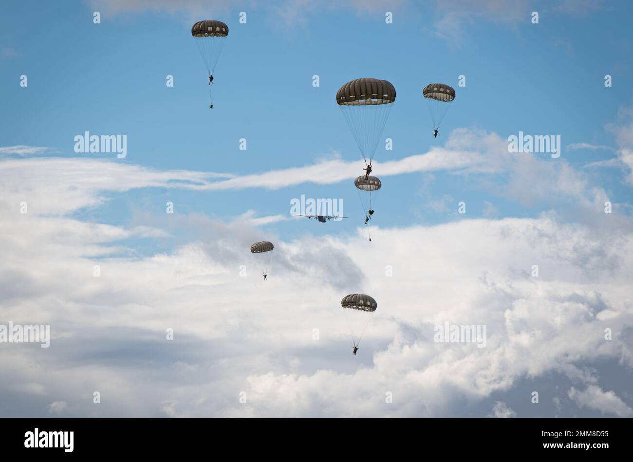 Airmen assigned to the 435th Contingency Response Group jump out of a C ...
