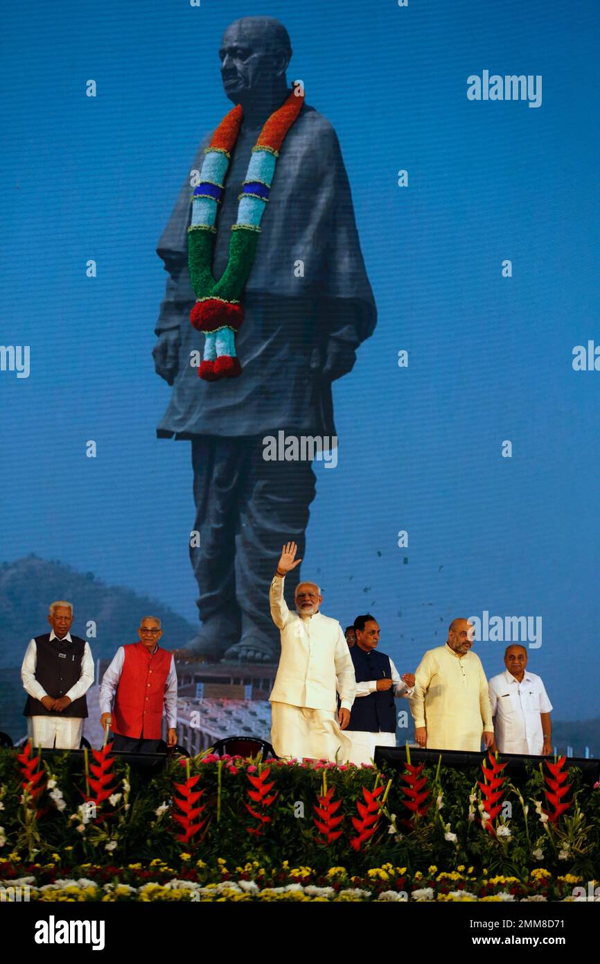 Indian Prime Minister Narendra Modi, centre, waves during the ...