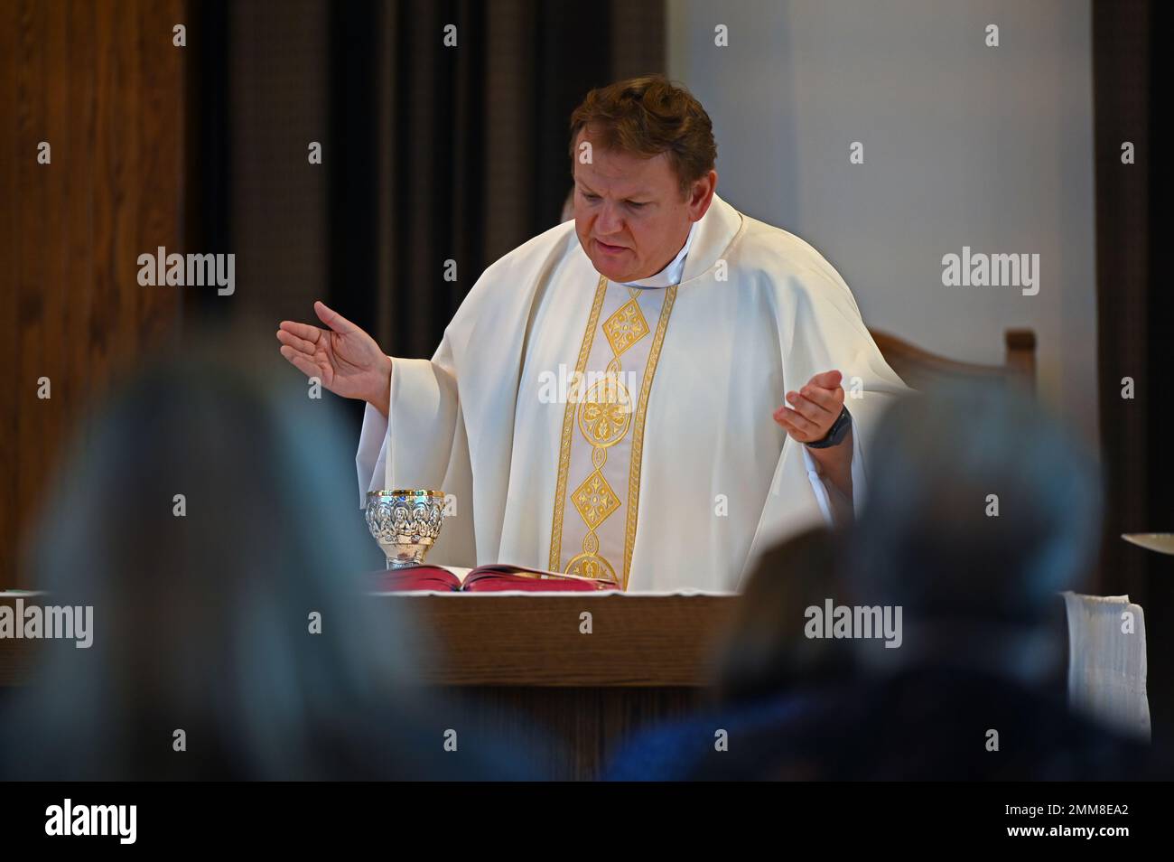 Father Filip Wodecki reads text to the Hanscom Air Force Base chapel ...
