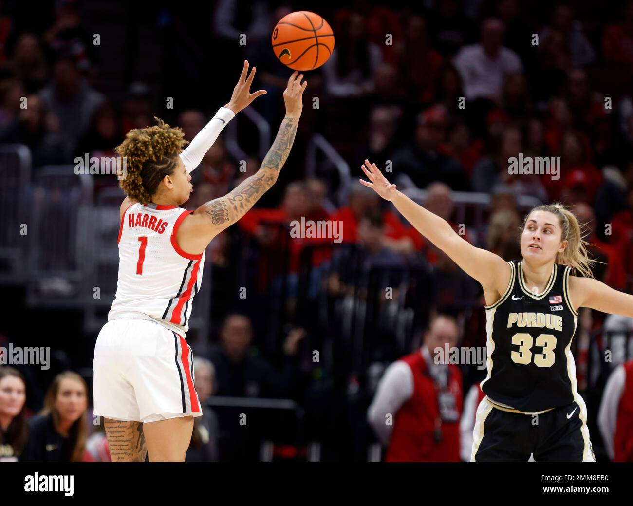 Ohio State guard Rikki Harris, left, shoots in front of Purdue guard ...