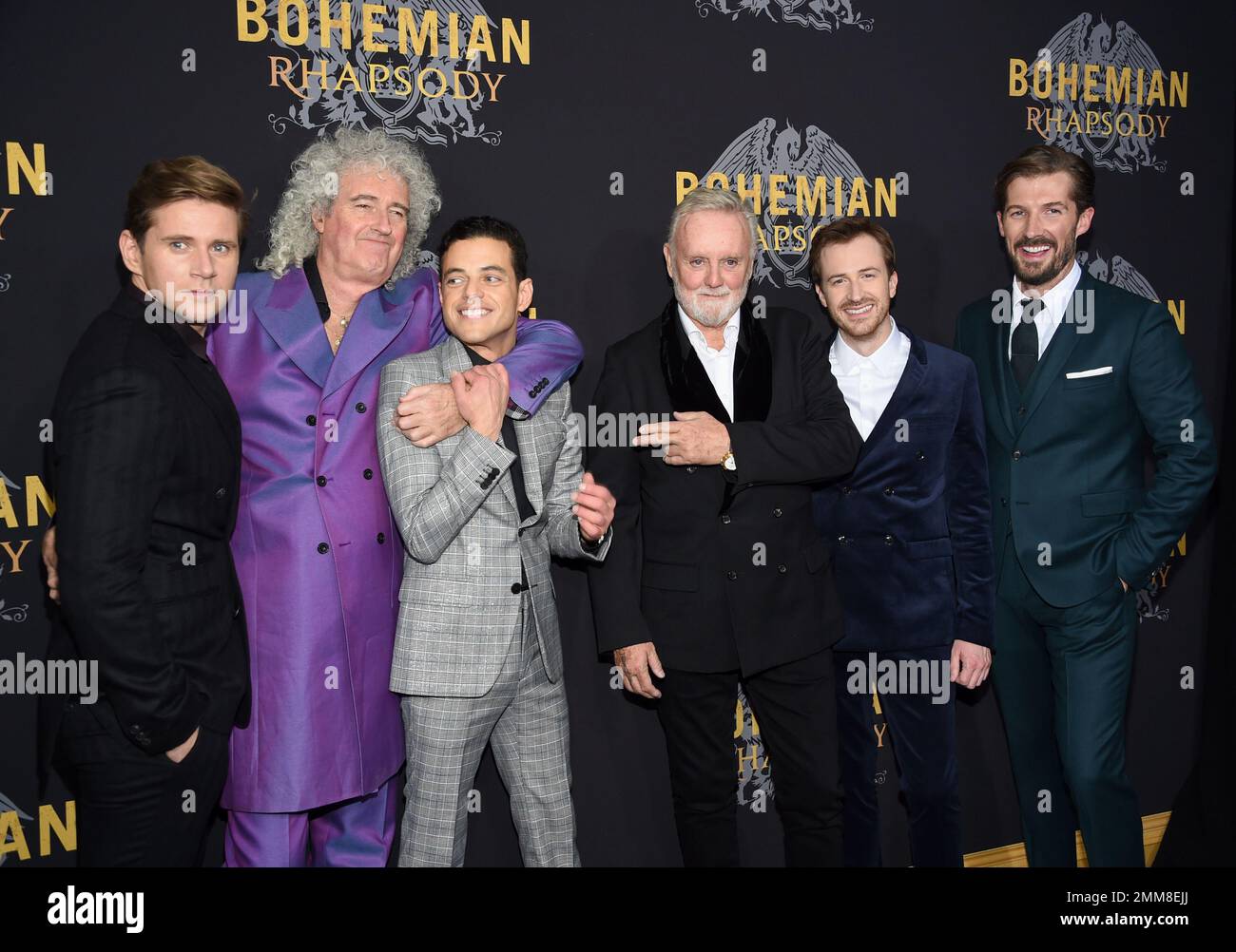 Actor Allen Leech, left, musician Brian May, actor Rami Malek, musician ...