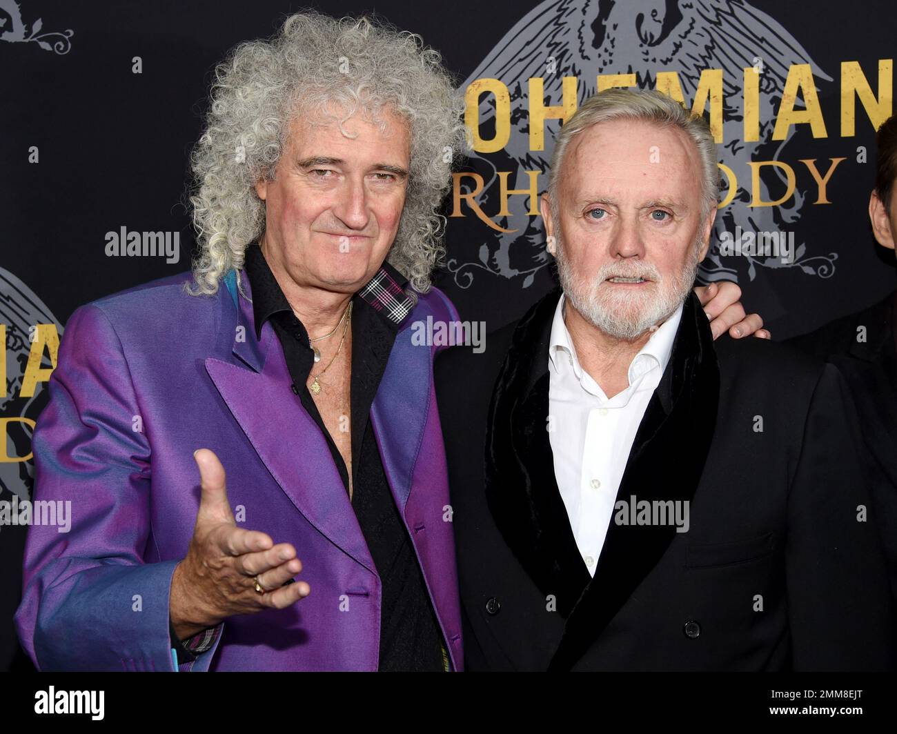 Queen band members Brian May, left, and Roger Taylor attend the ...