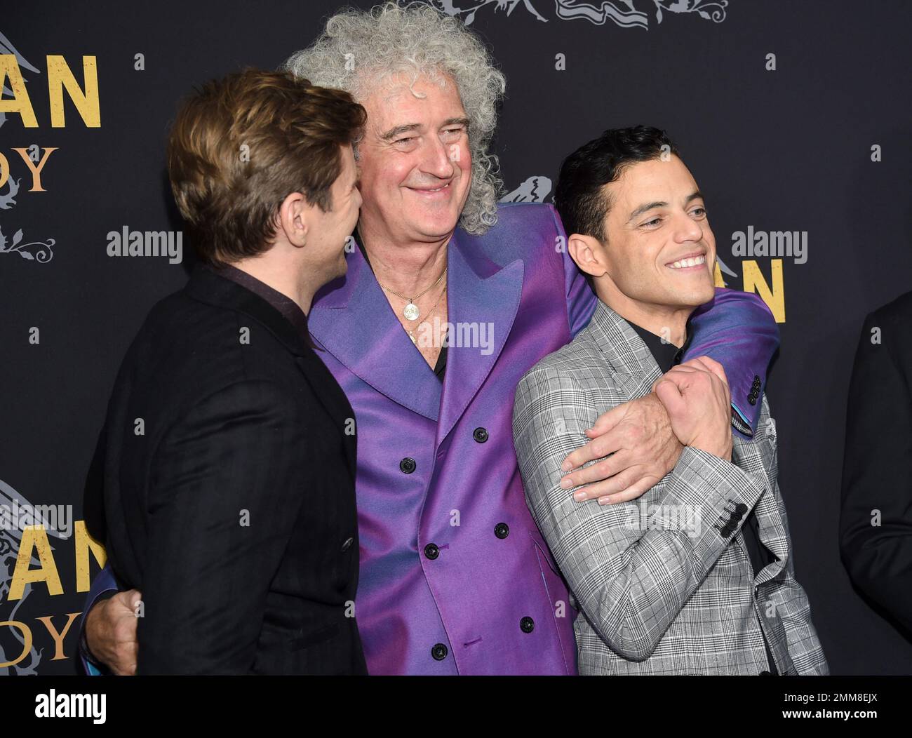 Musician Brian May, center, poses with actors Allen Leech, left, and ...