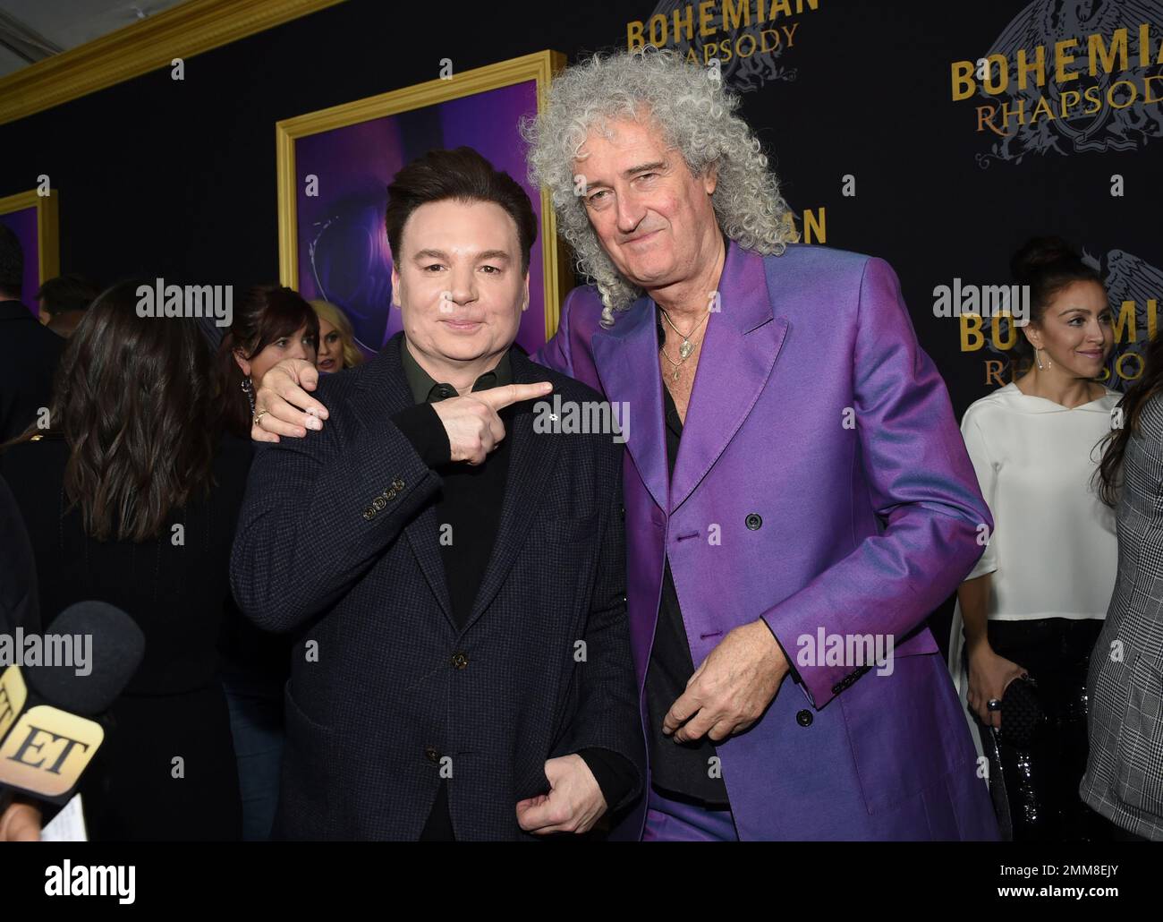 Actor Mike Myers, left, and musician Brian May attend the premiere of ...