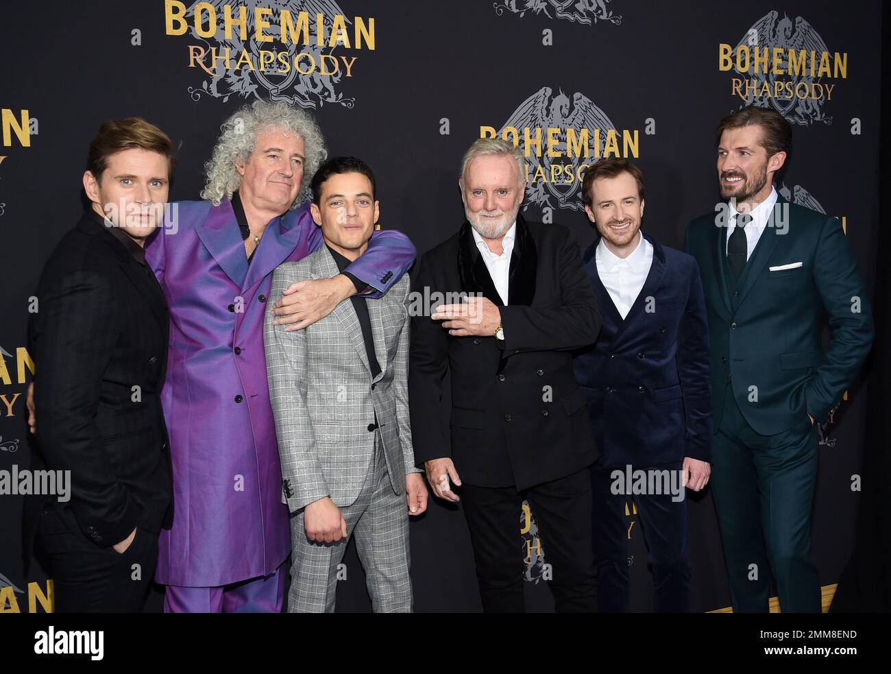 Actor Allen Leech, left, musician Brian May, actor Rami Malek, musician ...