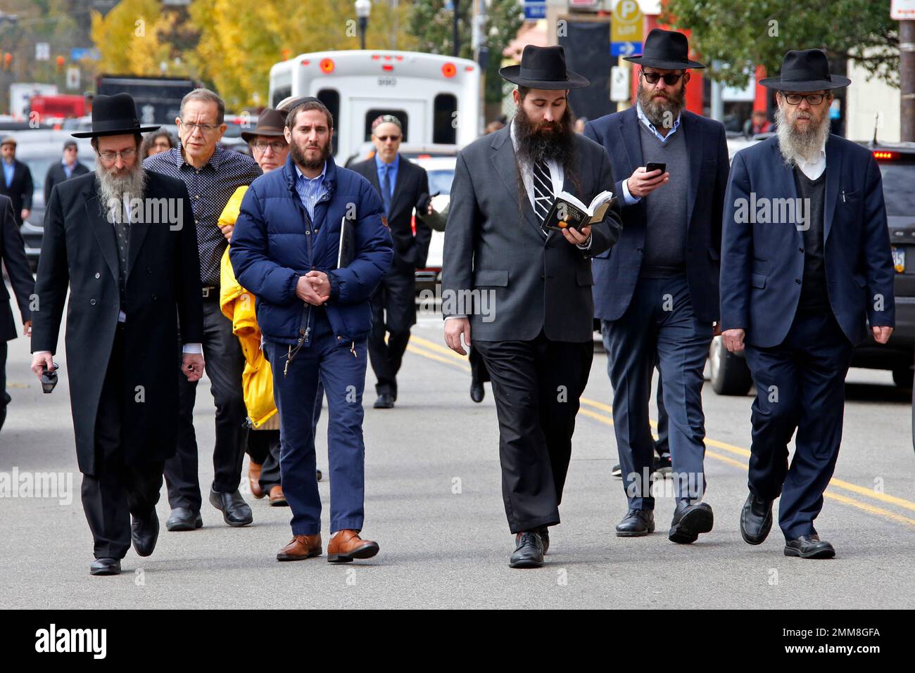 Mourners walk behind the hearse carrying the casket of Dr. Jerry ...