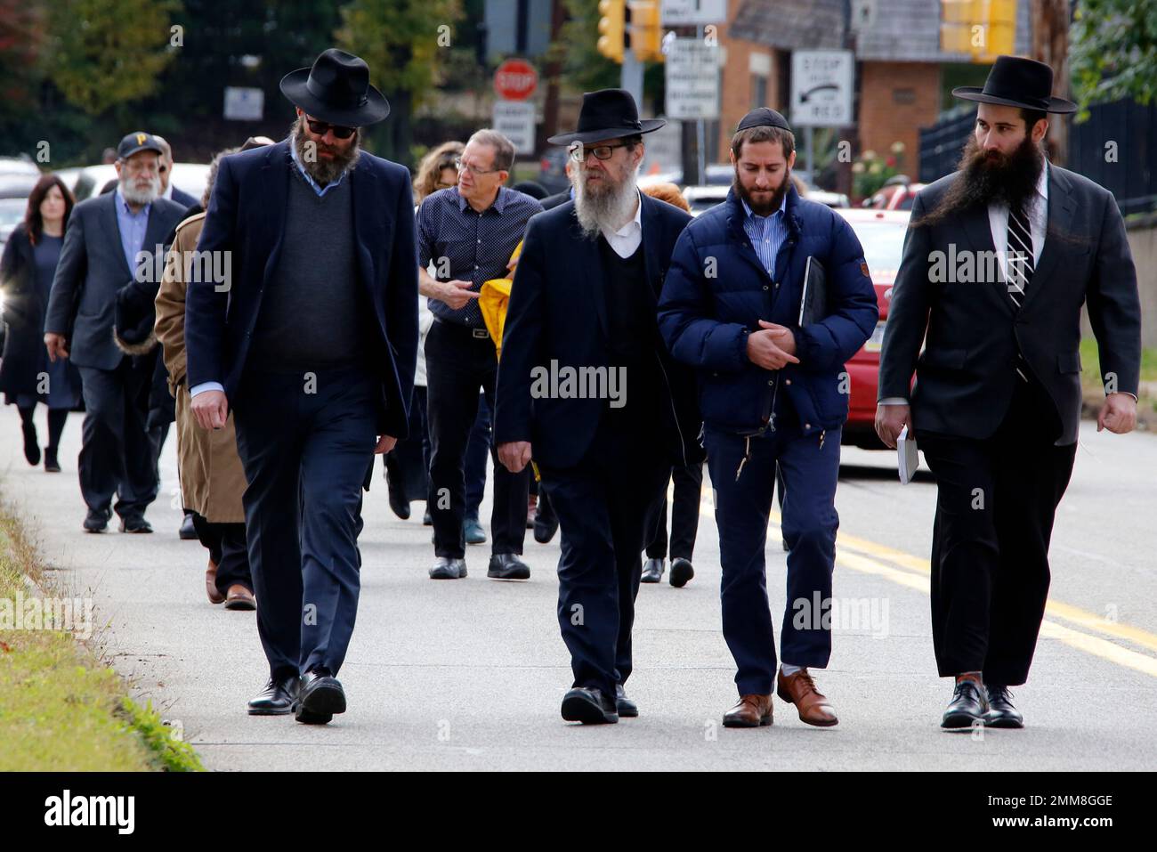 Mourners walk behind the hearse carrying the casket of Dr. Jerry ...