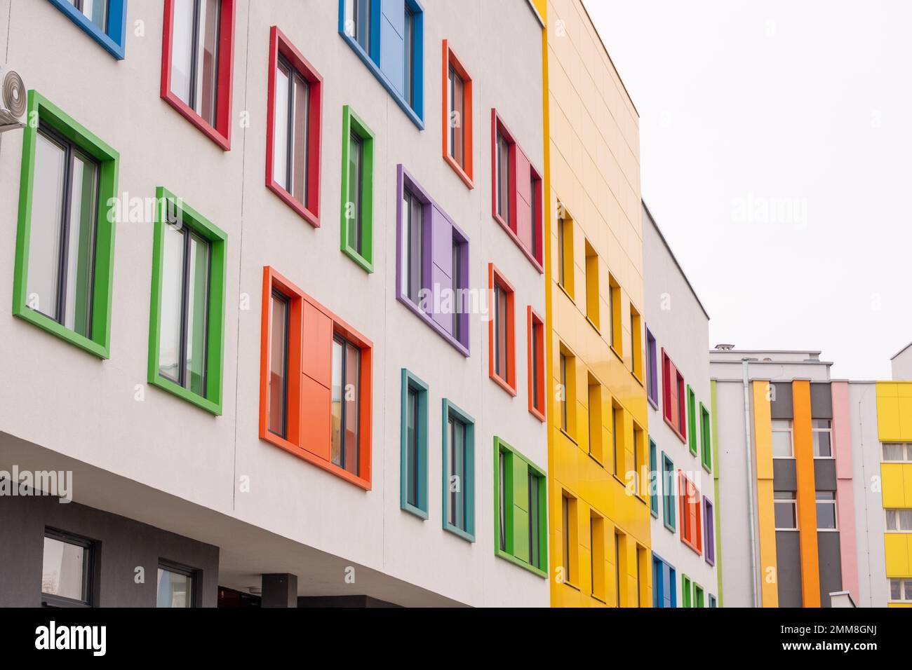 The facade of the building is decorated with different colors of ...