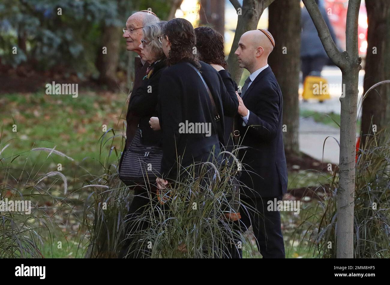 Mourners arrive for the funeral service for Dr. Jerry Rabinowitz, at ...