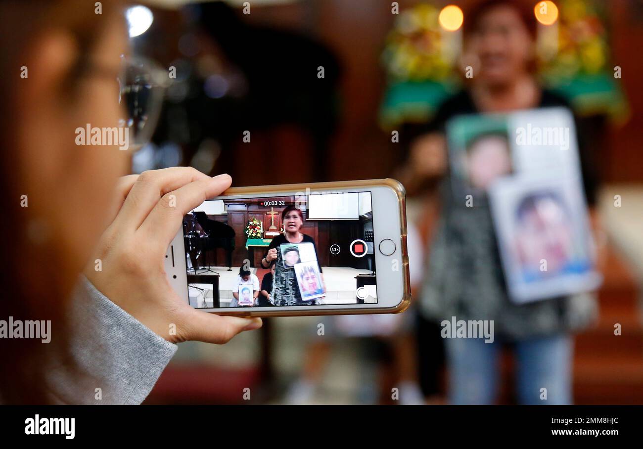 A journalist takes a cellphone video of Nanette Castillo, the mother of ...
