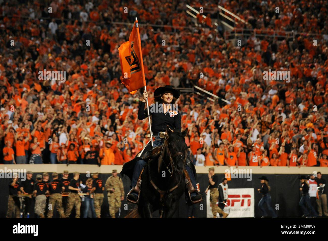 The Oklahoma State Spirit Rider celebrates a touchdown during an NCAA ...